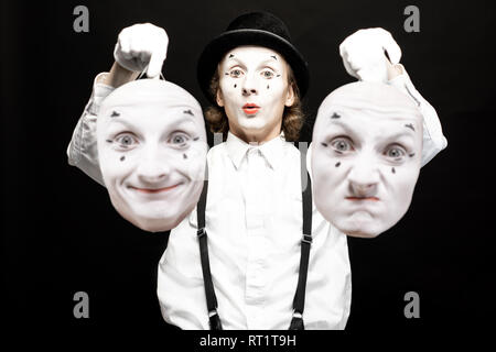 Masks with different emotions of pantomime on the black background ...