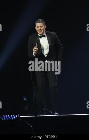 Singer Michael Bublé is shown performing on stage during a "live ...