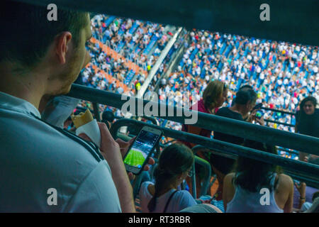 Spectators during football match. Santiago Bernabeu stadium, Madrid ...