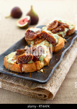 Toast of fig and cheese Stock Photo - Alamy