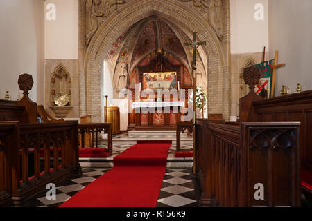The altar of a High Church Anglican church with candles and a picture ...
