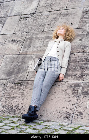 Full body shot of beautiful blonde businesswoman with braided hair ...