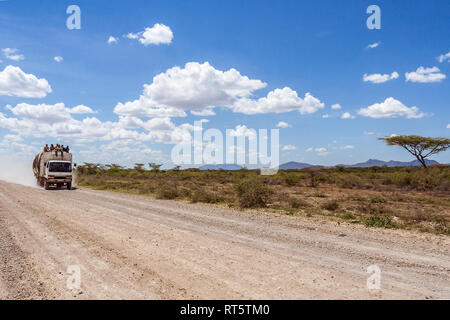 Nanyuki, Kenya, May 18, 2017 : People traveling on a stony track in a ...