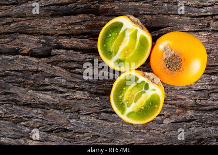Fruit of lulo on tree bark (Solanum quitoense Stock Photo - Alamy