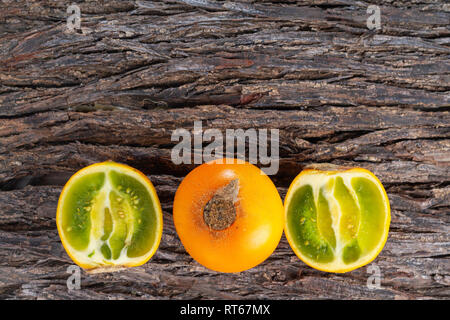 Fruit of lulo on tree bark (Solanum quitoense Stock Photo - Alamy