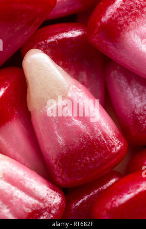 macro of pink candy corn kernels as a concept or background Stock Photo ...