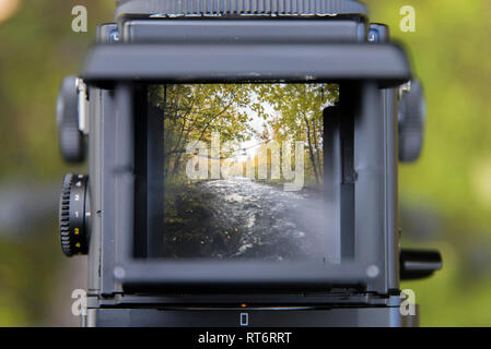 Looking through the viewfinder of Mamiya RZ67 medium format film camera ...