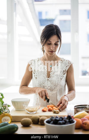 Woman preparing healthy food in kitchen Stock Photo - Alamy