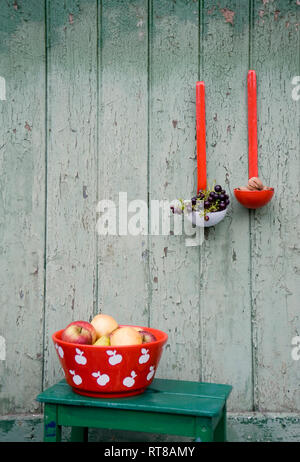 Bowl of walnuts and red apples on wooden table. Healthy snacks Stock ...