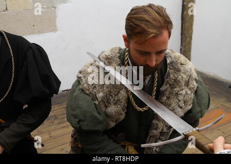 Two knight figures with sword on the wall of the Ancienna Dovane ...