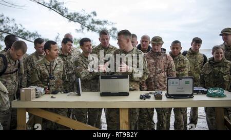 A Joint Communications Support Element (JCSE) soldier boards a C-17 ...