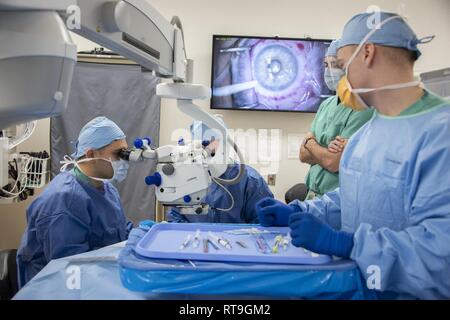 U.S. Army Capt. (Dr.) Nikhil Godbole, staff ophthalmologist, and U.S ...