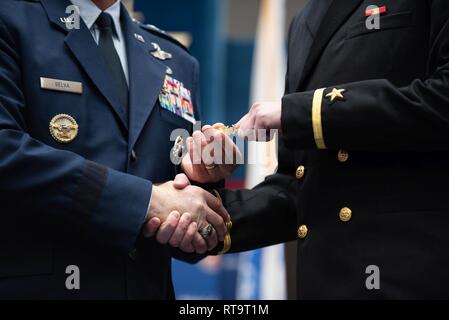 A newly graduated Naval Flight Officer poses for a photo with family ...