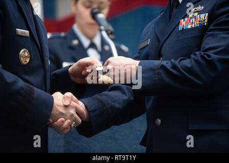 A newly graduated Air Force Combat Systems officer receives their wings ...