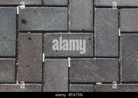 Cigarette stubs on a cobblestone street Stock Photo - Alamy