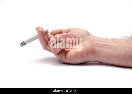 Smoking and money. Rolled up dollar bill in a cigarette pack. Green ...