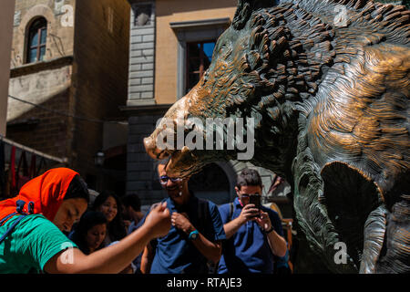 Touching the lucky Pig il Porcellino in Florence, Italy Stock Photo - Alamy
