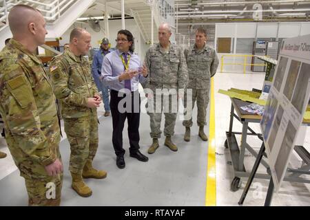 Air Force Col. Robert Lyons (center), salutes Air Force Lt. Gen. Eric ...