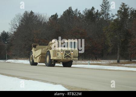 Vehicles and equipment after being loaded onboard MV Anvil Point at the ...