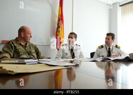 Royal Naval captain and commander discuss operations on the HMS ...