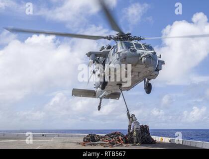 The amphibious cargo ship USS ST. LOUIS (LKA-116) lies at anchor in the ...