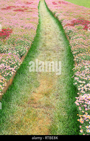 Path cutting through blooming flowers, Genoa, Liguria, Italy, Europe ...