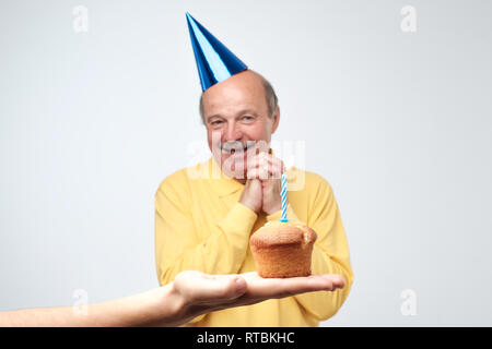 Portrait of delighted overjoyed person sit chair raise fists shout yes ...