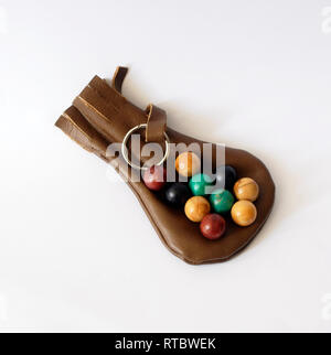 Old toy marbles in leather bag Stock Photo - Alamy