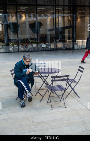 Businessman using a mobile phone near a broken down car, Gurgaon ...