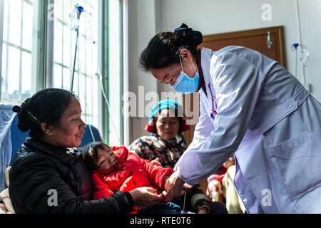 The doctor gives the child an injection in the buttock. Selective focus ...