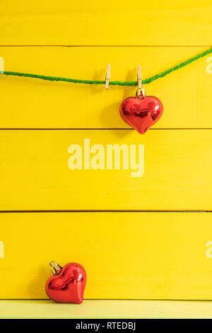 Decorative heart on rope, on wooden background Stock Photo - Alamy