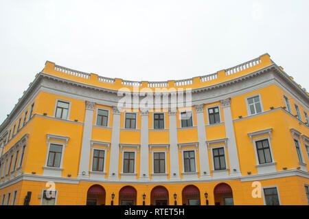 Exterior of european yellow building with many windows, neoclassic ...