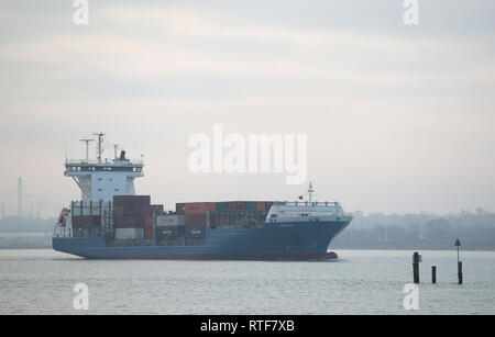 The container ship Helga makes her way past the container ship CMA CGM ...
