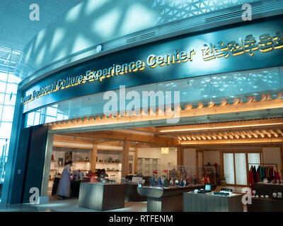 Incheon International Airport's shopping concourse with duty free shops ...