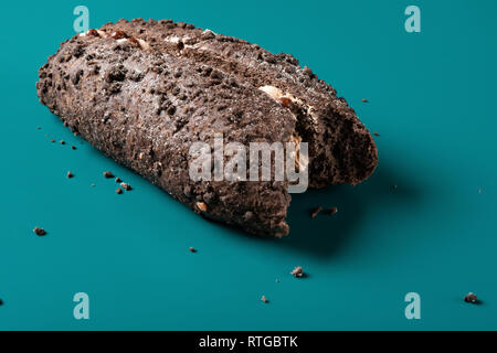 chocolate flavor bread with some bites on blue background Stock Photo ...