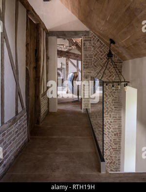 Medieval brickwork and oak beams with glass balustrade Stock Photo - Alamy
