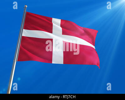 official flag of Danish blue ensign , Denmark at cloudy sky background ...