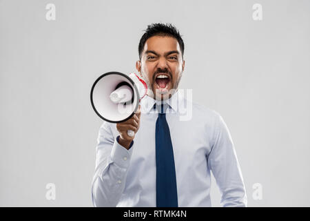 indian businessman screaming over grey Stock Photo - Alamy
