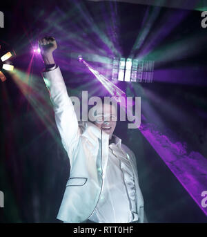 Young handsome man dj holding disco plate Stock Photo - Alamy