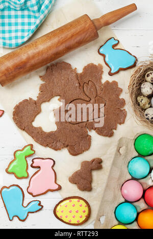 Easter greeting card with cooking gingerbread cookies and colorful eggs ...