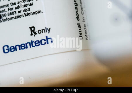 A Genentech logo is seen on prescription pharmaceutical packaging ...