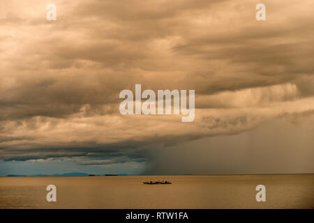 Kapenta boats head out for an evenings fishing on Lake Kariba, Zimbabwe ...