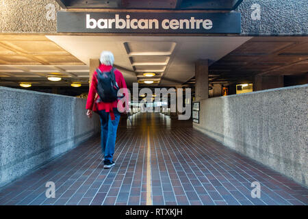 Walking through the interior walkways of the Barbican centre Stock ...