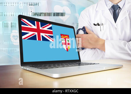 Fijian Doctor standing with stethoscope on Fiji flag background ...