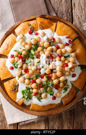 Fatteh Pita with Chickpeas and Yogurt traditional arabic dish closeup ...
