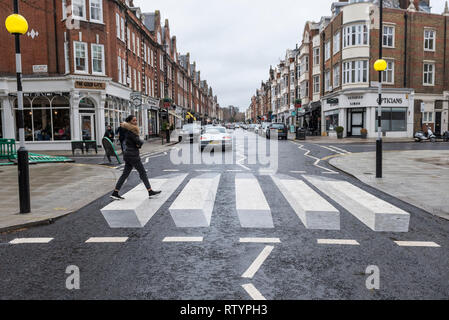 A Raised Zebra crossing in the UK which alco acts sa a speed hump Stock ...