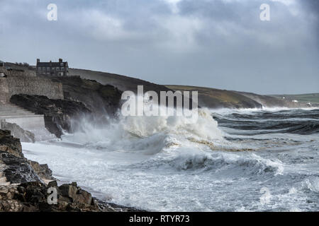 Porthleven clock tower with crashing storm waves,Huge waves generated ...