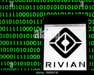 Rivian Automotive company logo seen displayed on smart phone Stock ...