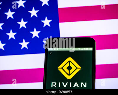 Rivian Automotive company logo seen displayed on smart phone Stock ...