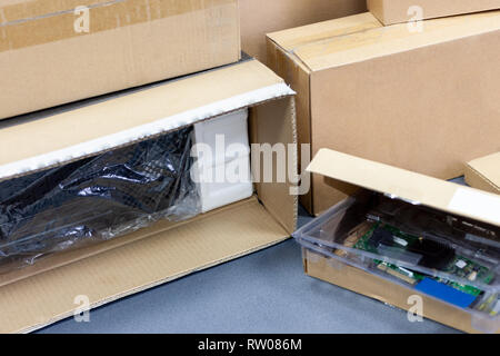 unpacking black personal computer, back view, cellophane packaging ...